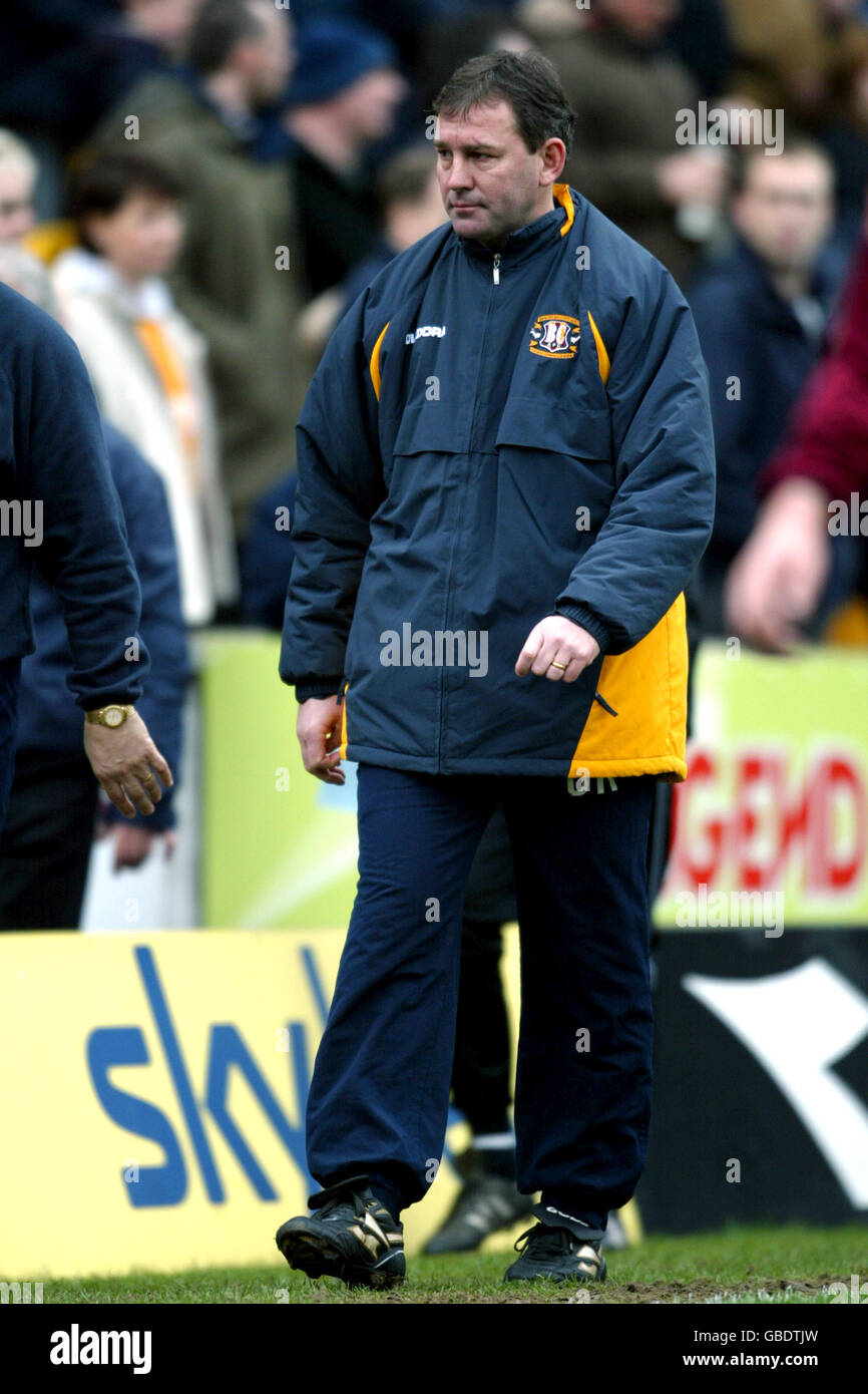 Bradford City manager Bryan Robson leaves the pitch dejected after his ...