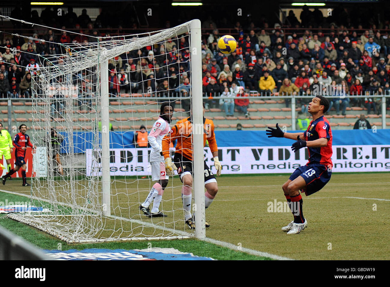 Genoa's Matteo Ferrari (right) watches on as his effort hits the bar ...