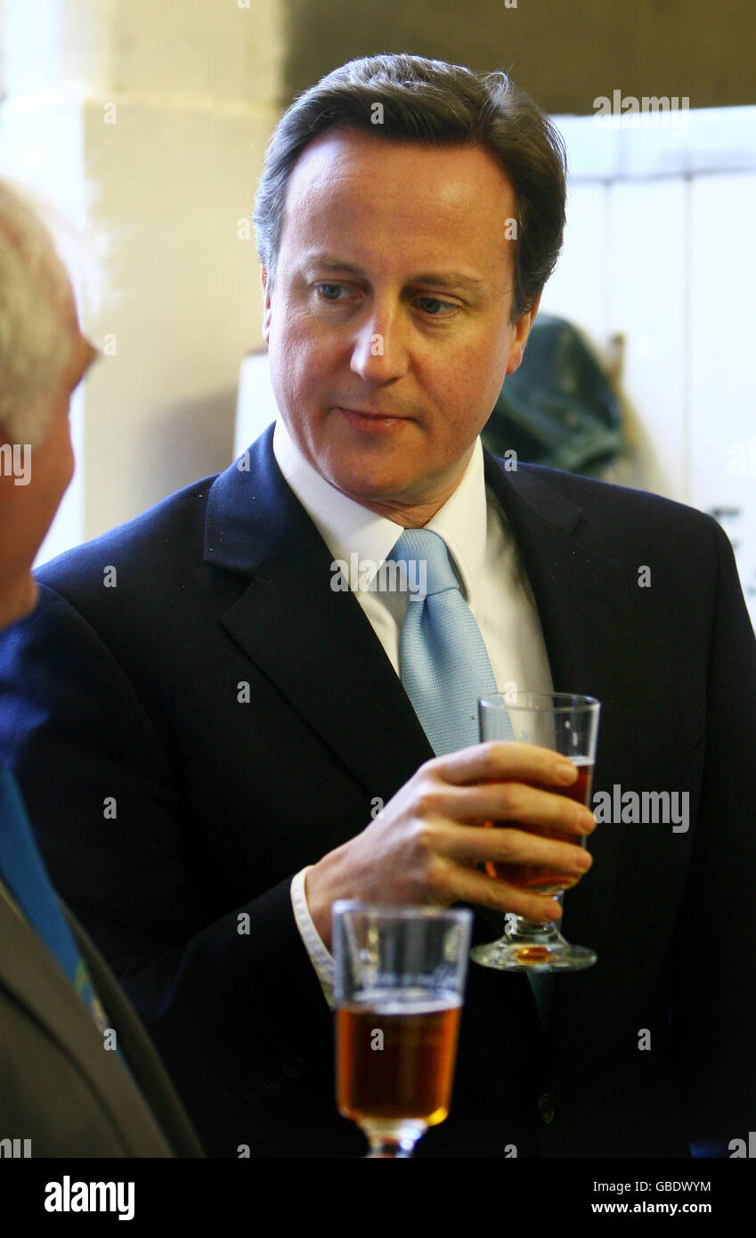 Conservative Party Leader David Cameron samples some beer during a ...