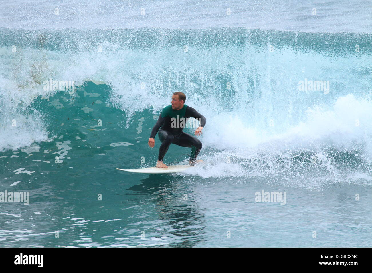 Surfer at Porthleven, Cornwall, England, UK Stock Photo - Alamy