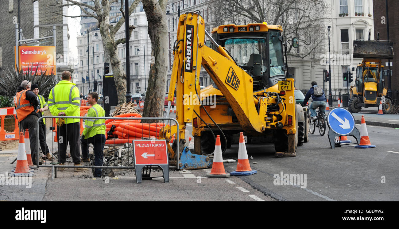 Roadworks in Cromwell Road, London by Transport for London staff. The ...