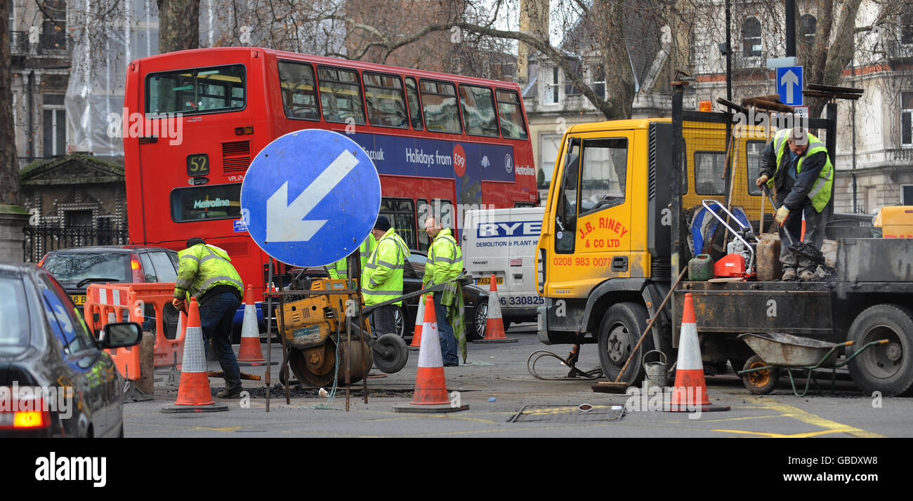 Roadworks in Cromwell Road, London by Transport for London staff. The ...