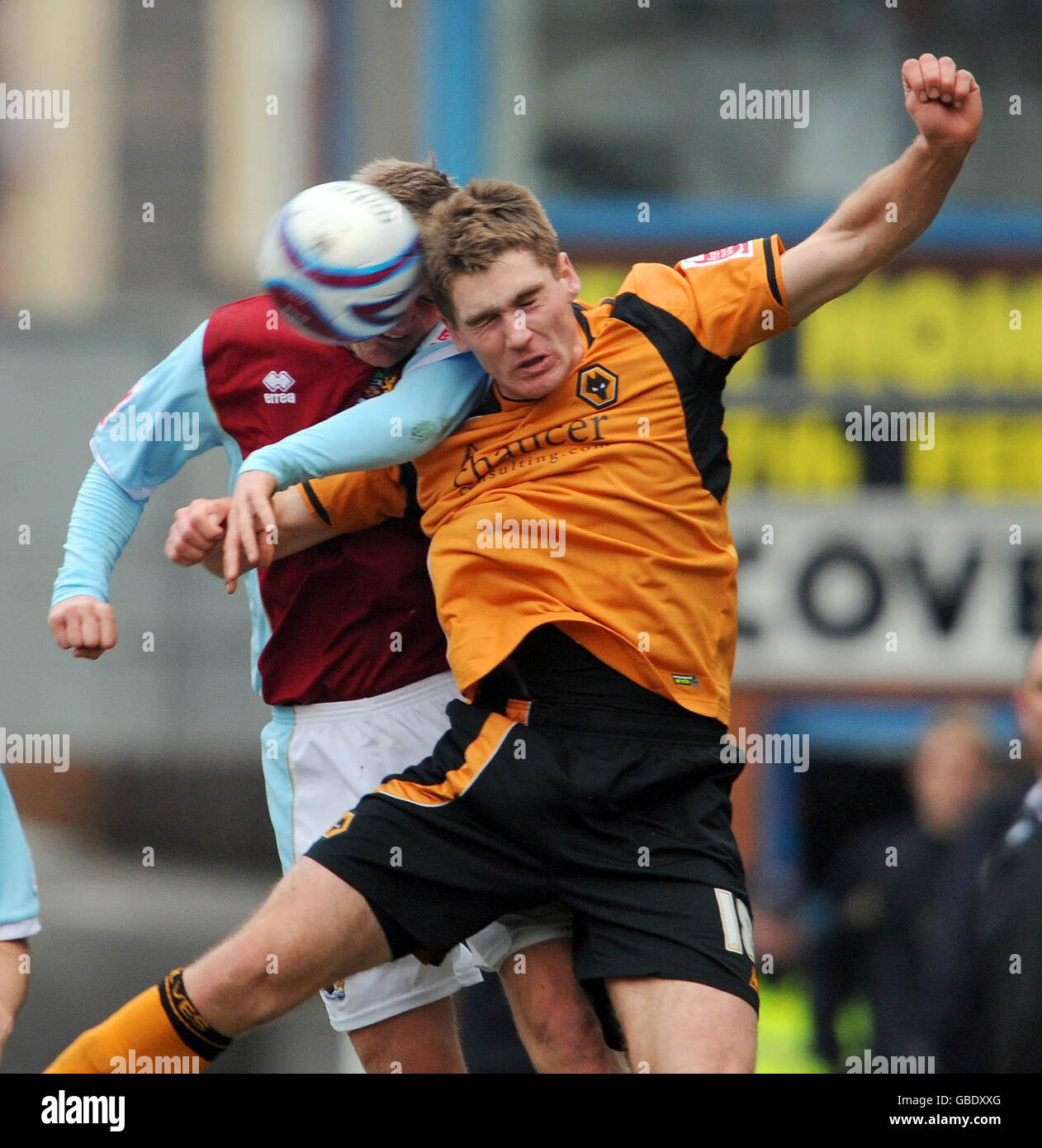 Wolves's Sam Vokes battles for a high ball with Burnley's Christian ...