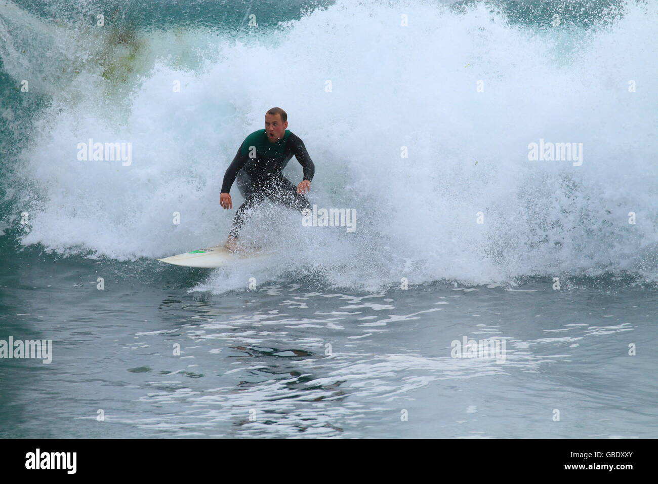 Surfer at Porthleven, Cornwall, England, UK Stock Photo - Alamy