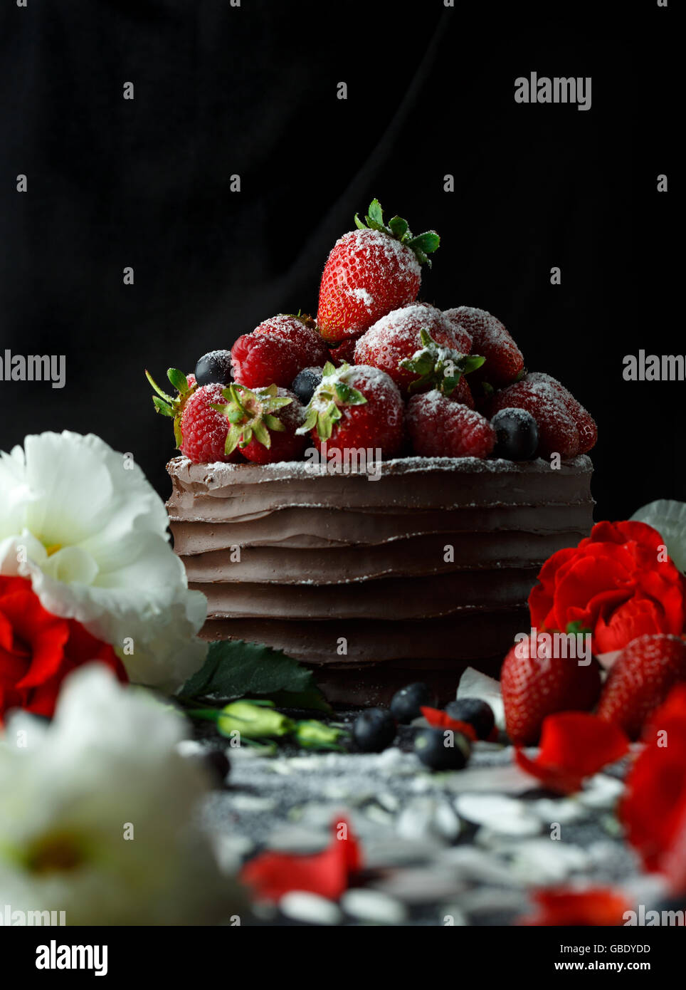 Ripe strawberries in a chocolate cake on a black background Stock Photo ...
