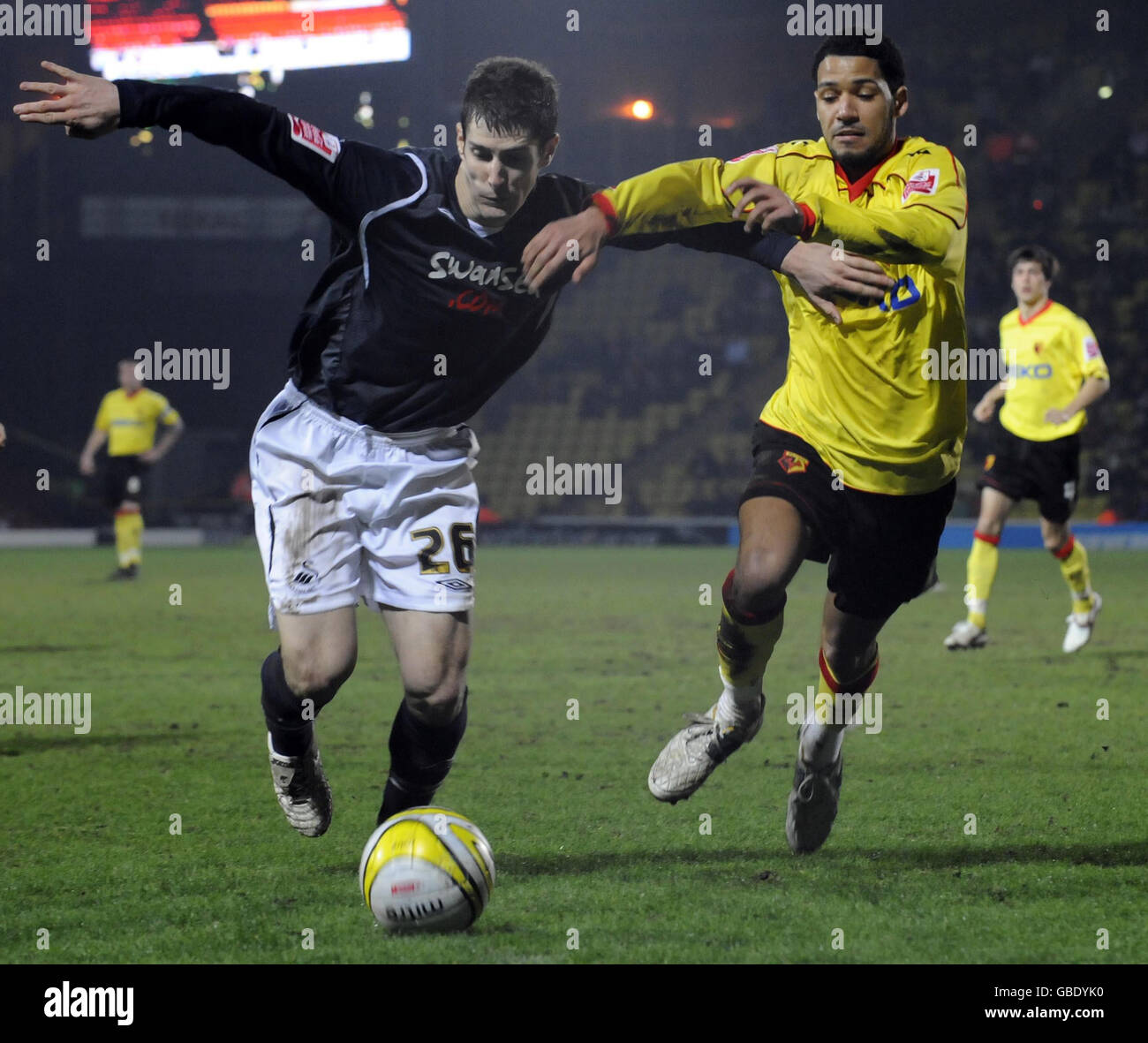 Swansea City's Albert Serran and Watford's Jobi McAnuff (right) battle ...