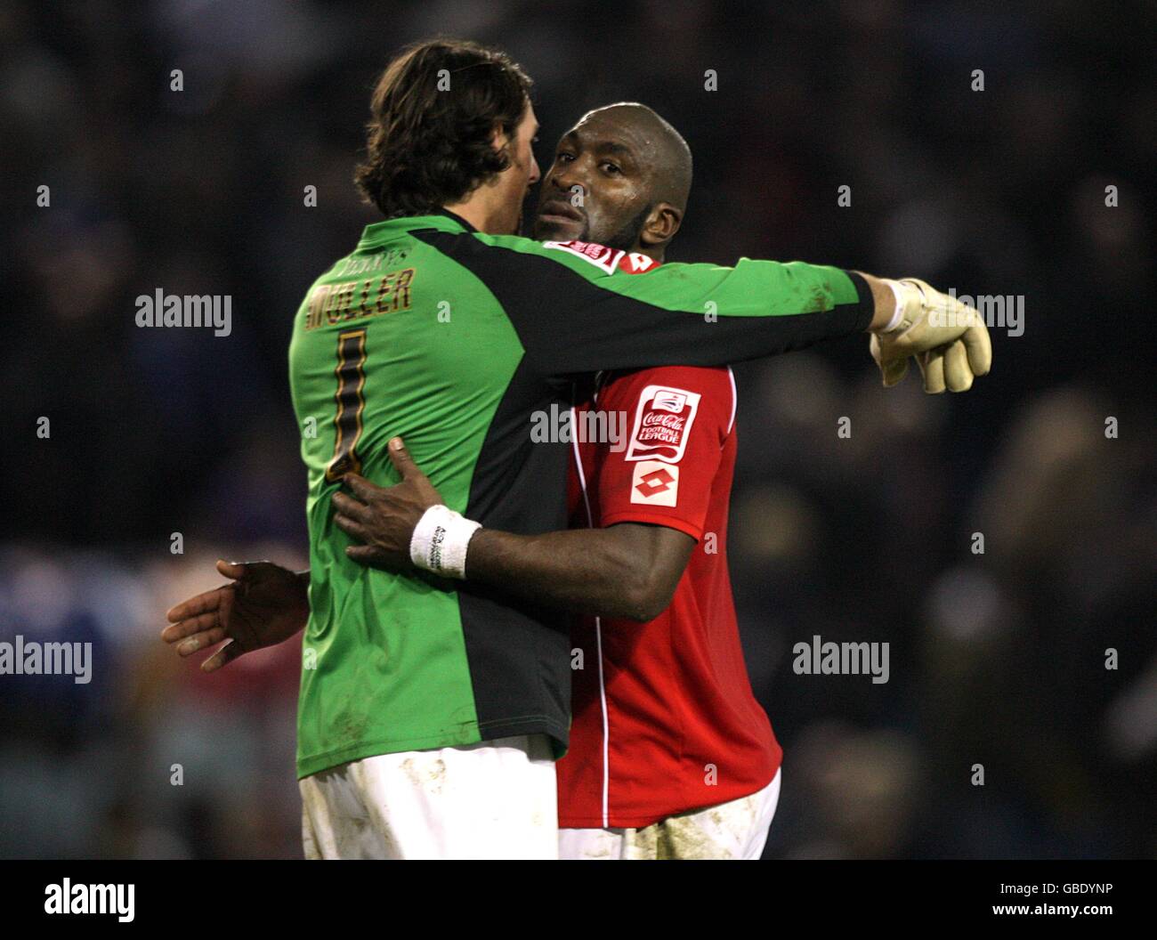 Barnsley's Darren Moore (right) and goalkeeper Heinz Muller celebrate ...