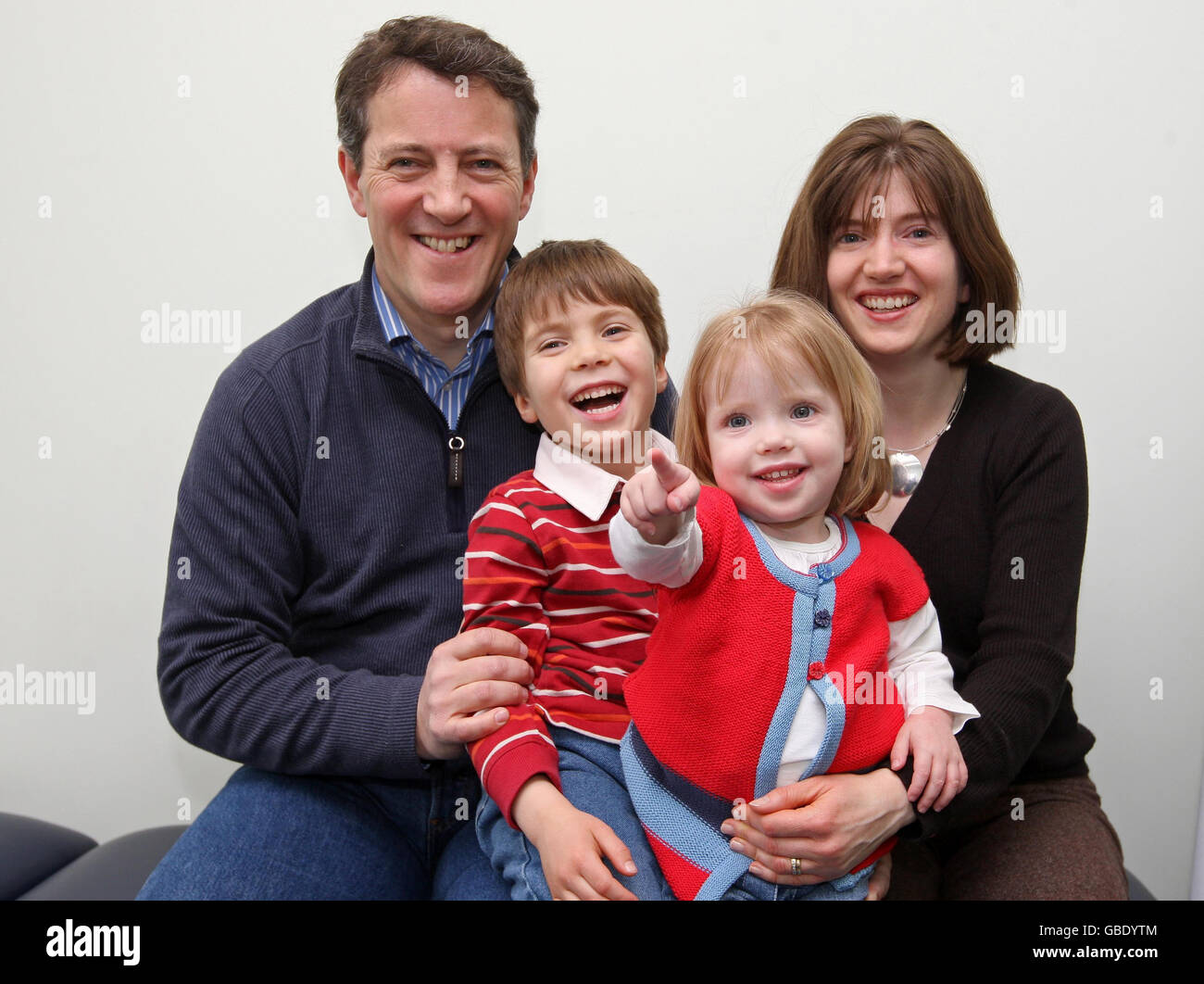 Sarah Cox, 2, with her parents Nigel and Jennie and her brother Matthew ...