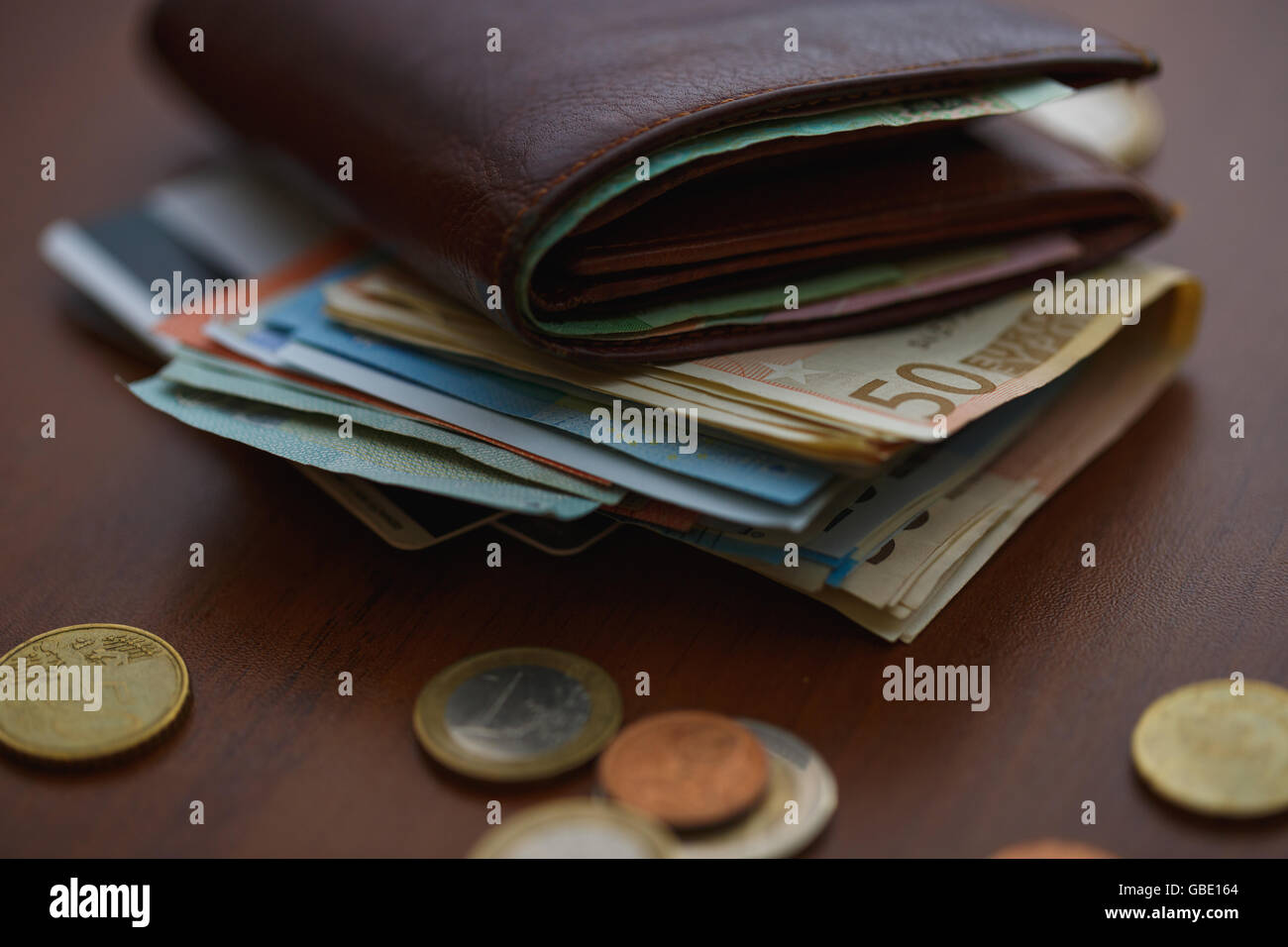 Leather purse banknotes coins hi-res stock photography and images - Alamy
