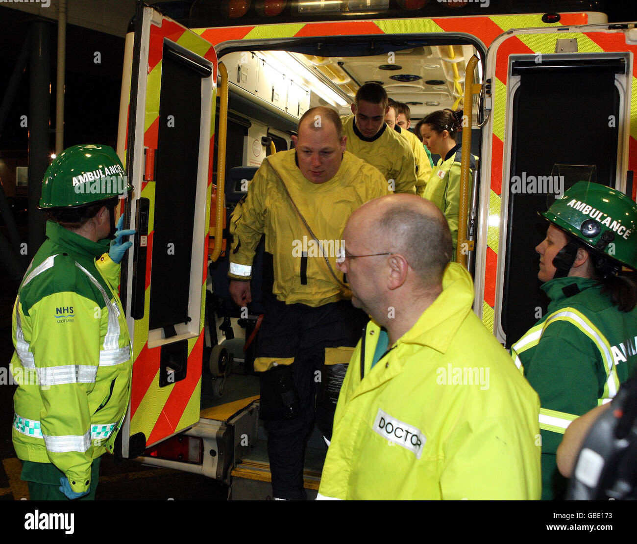 Rescued crew from the ditched helicopter arrive at the accident and ...