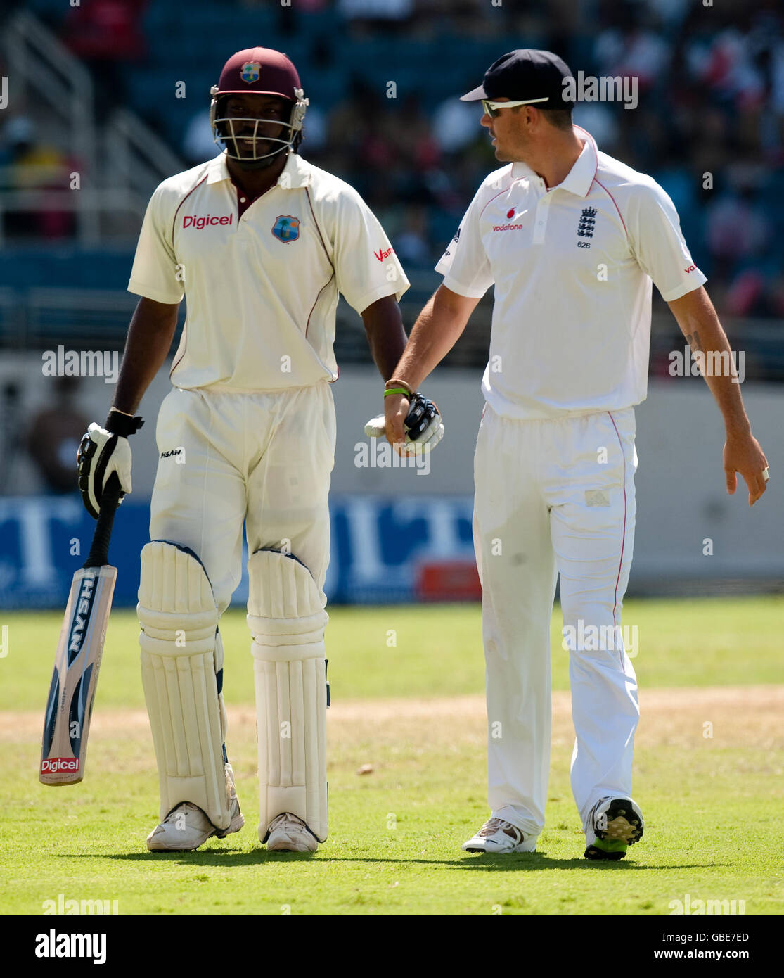 West Indian captain Chris Gayle (left) leaves the field in hand with ...