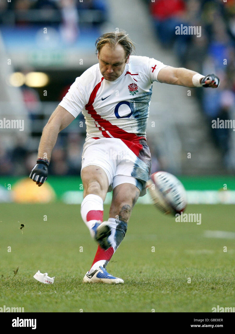 England's Andy Goode kicks a conversion after the first try during the ...