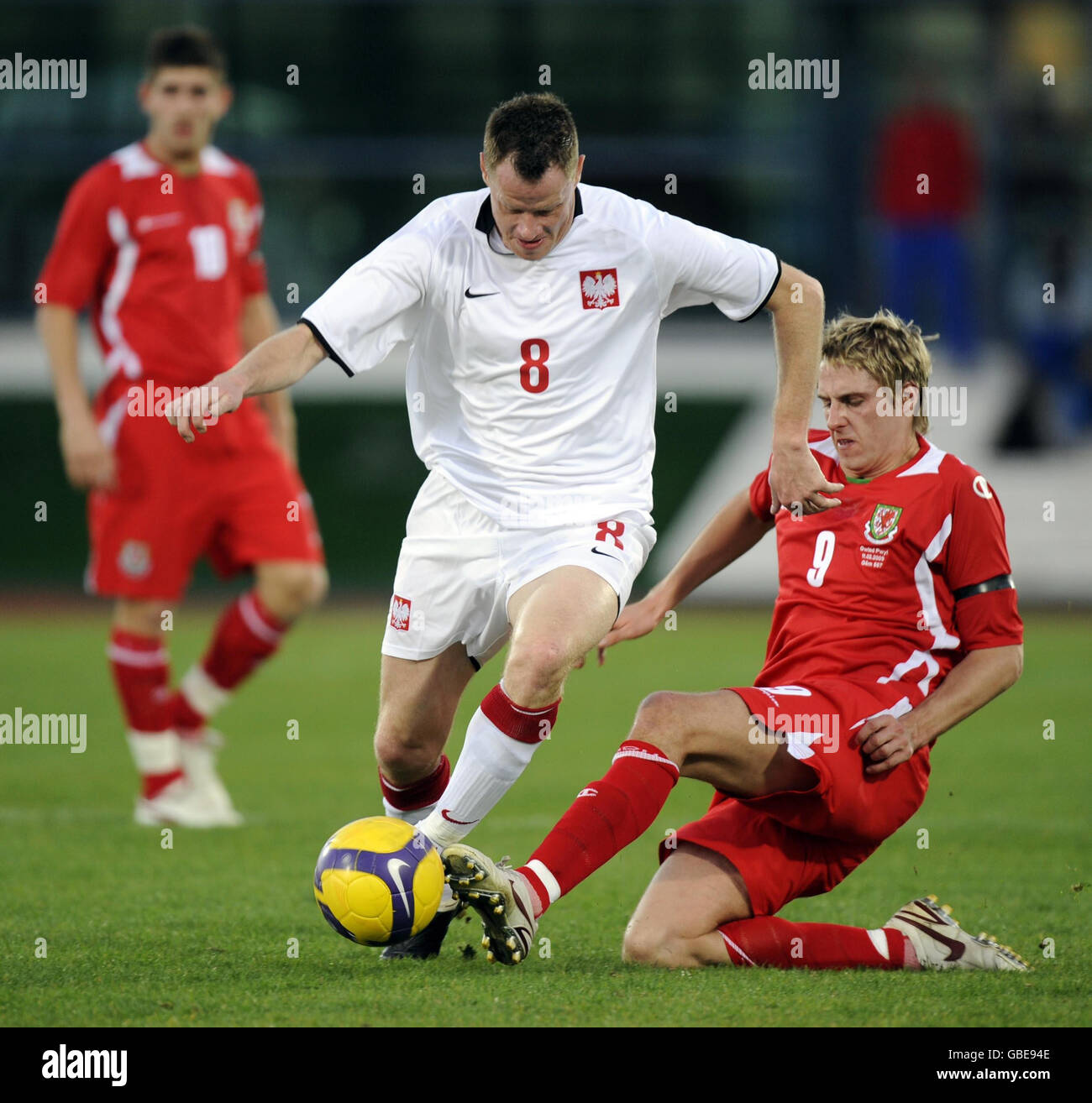 Wales' David Edwards (right) in action with Poland's Jacek Krzynowek ...