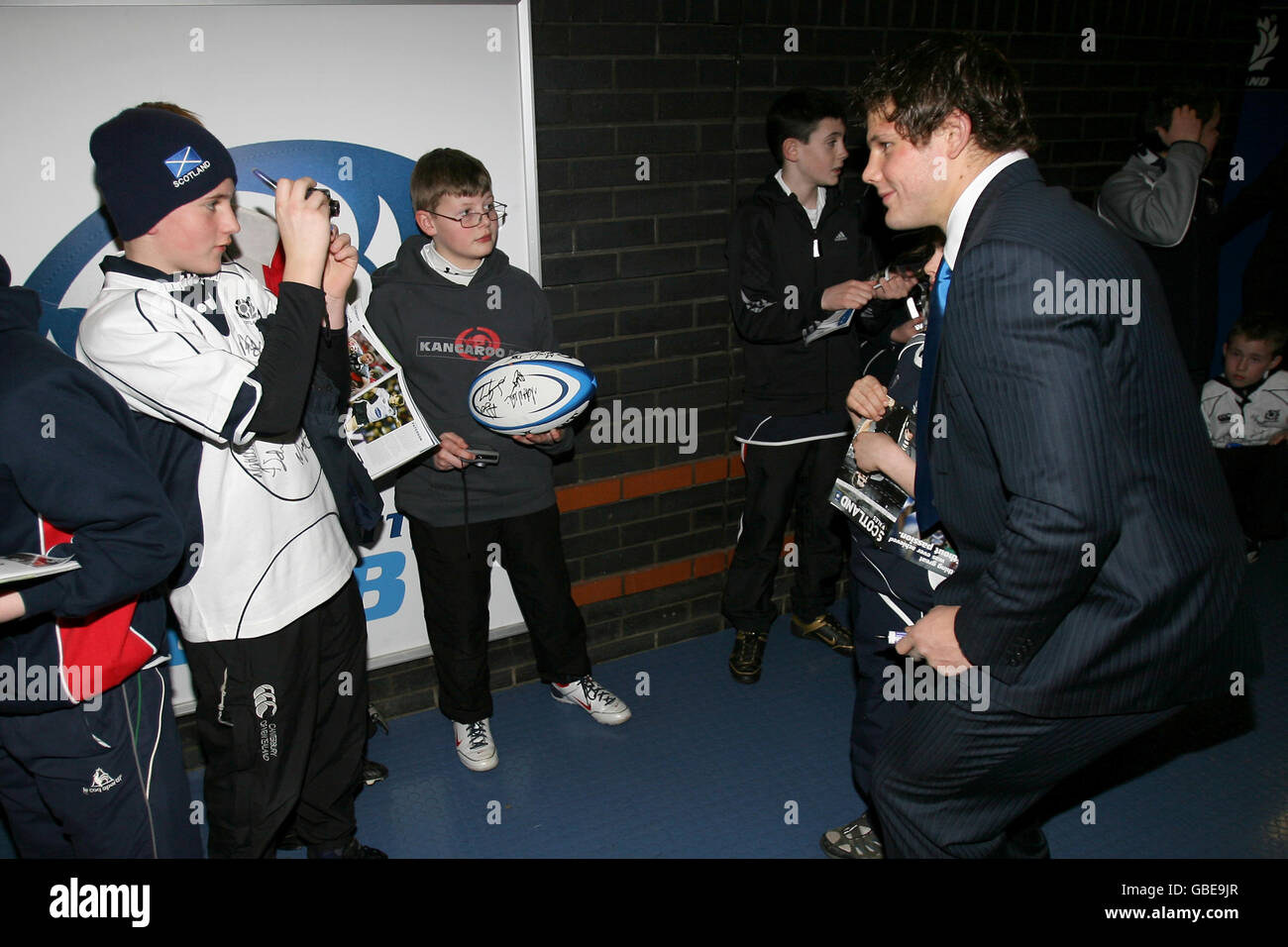 Scotland's Ross Ford poses for photographs with fans after the match ...
