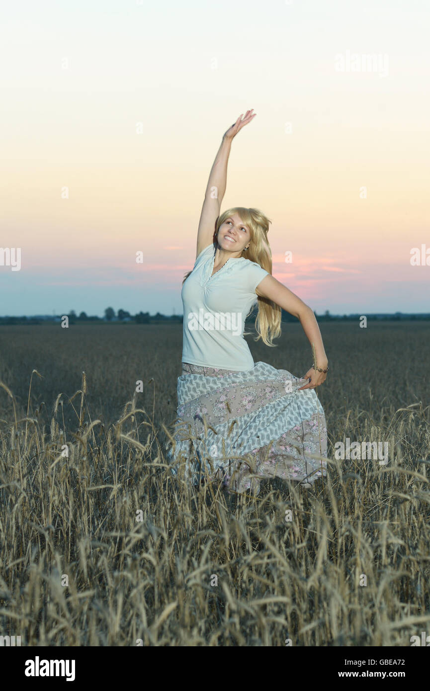 Woman in field Stock Photo - Alamy