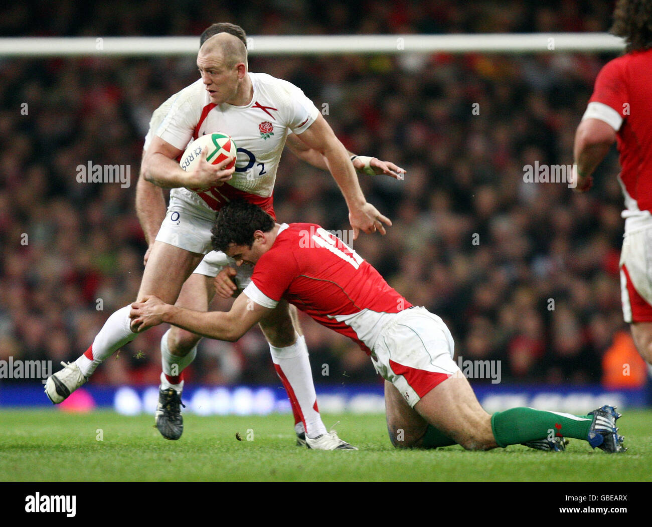 England's Mike Tindall is tackled by Wales Jamie Roberts during the RBS ...