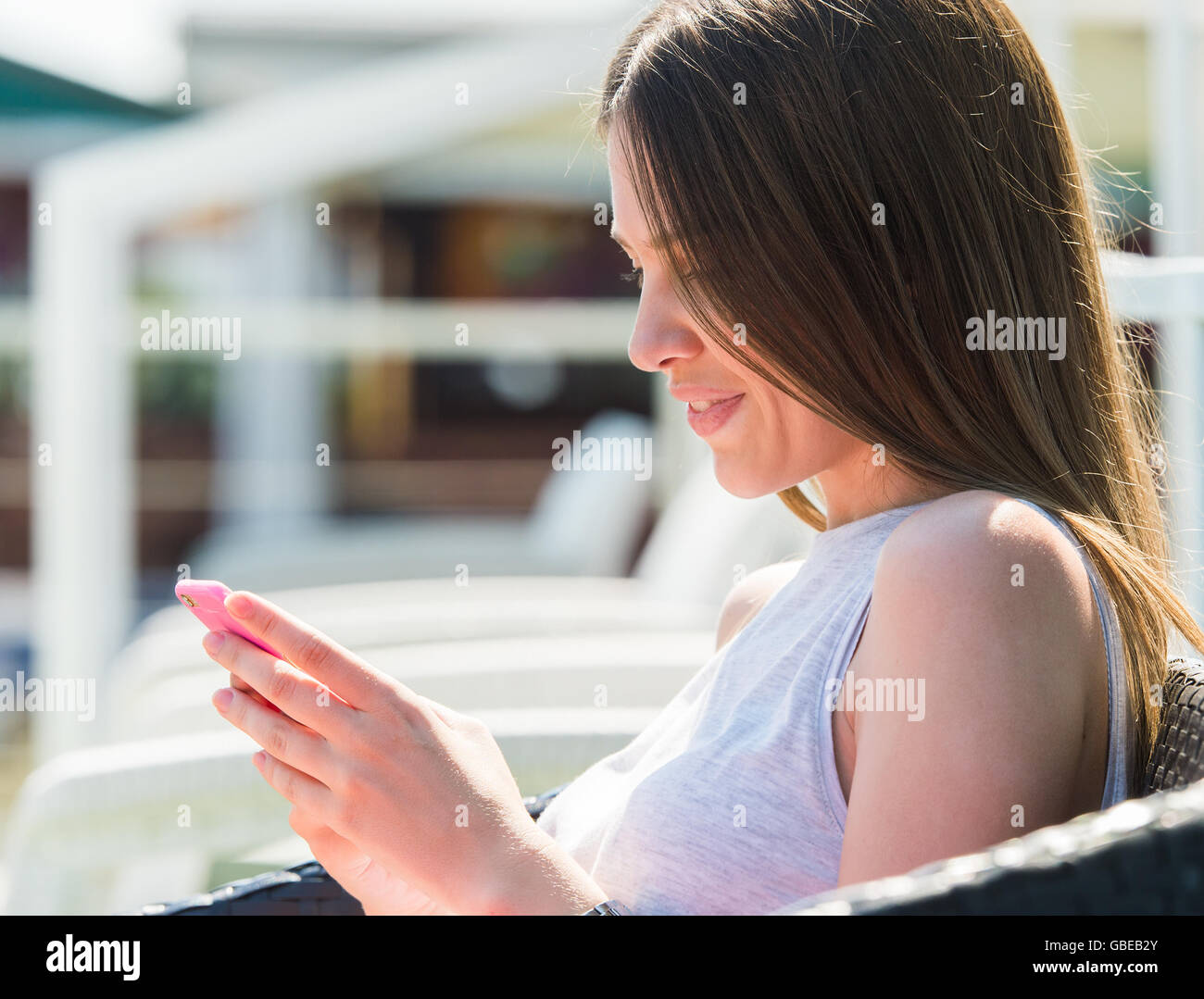 Pretty girl using mobile phone Stock Photo - Alamy