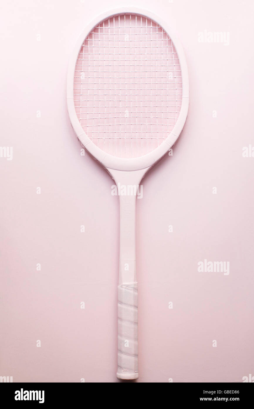 Pink racket tennis on pink table. Handmade vintage sport accessory ...