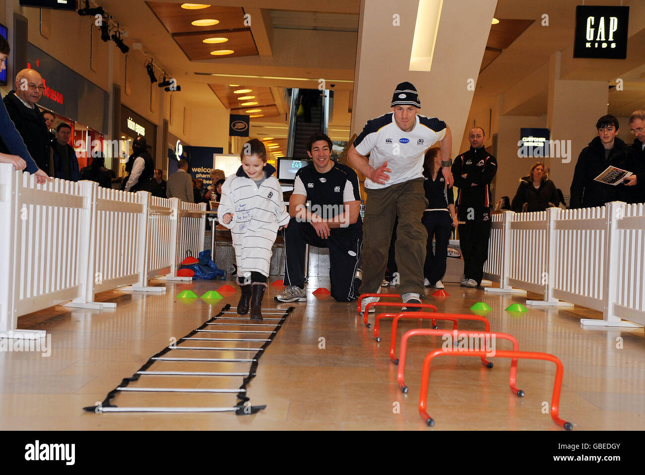 Simon Webster (right) races Megan Auld (5) during a rugby fun day at ...