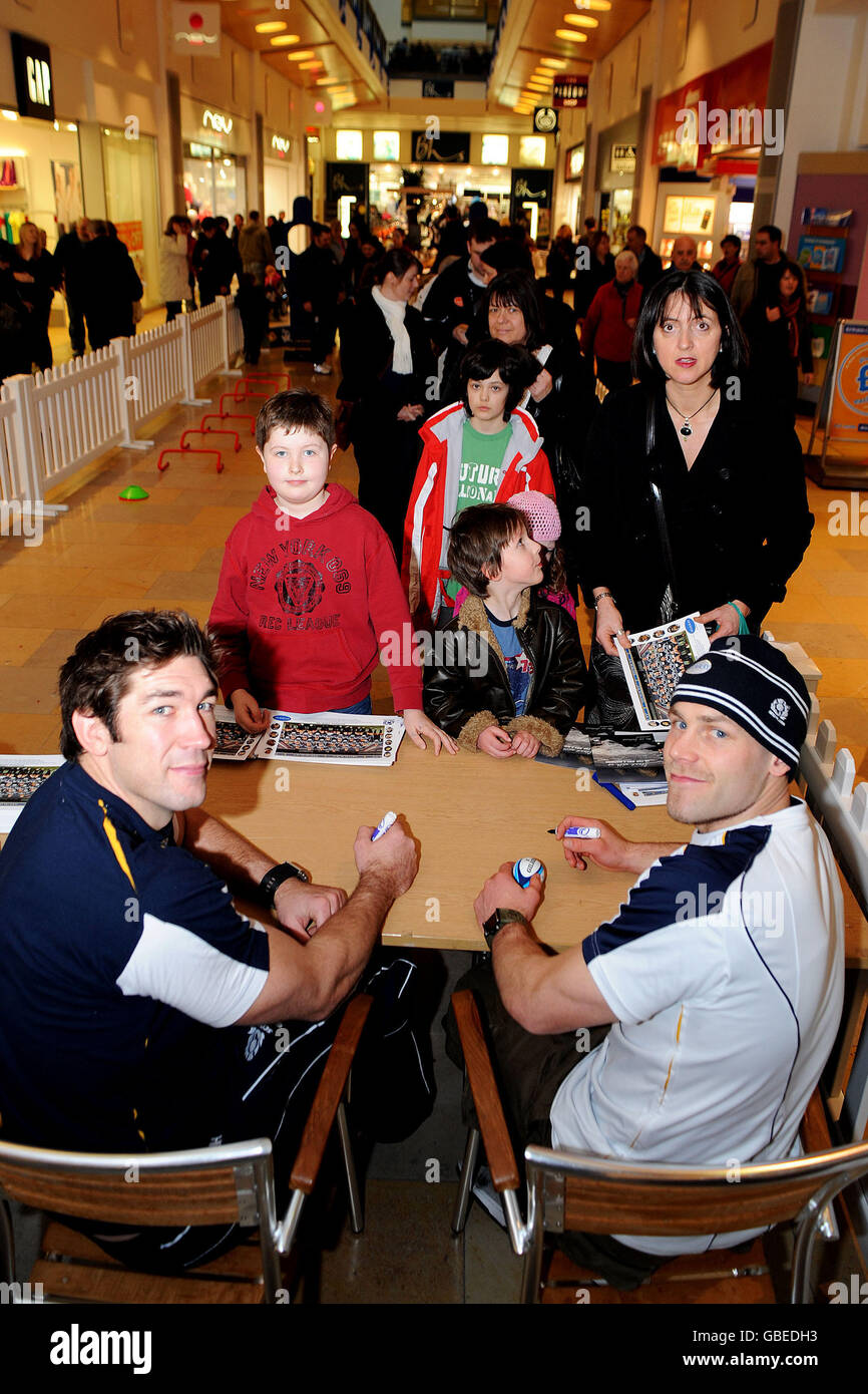 Nathan Hines (bottom left) and Simon Webster (bottom right) sign ...
