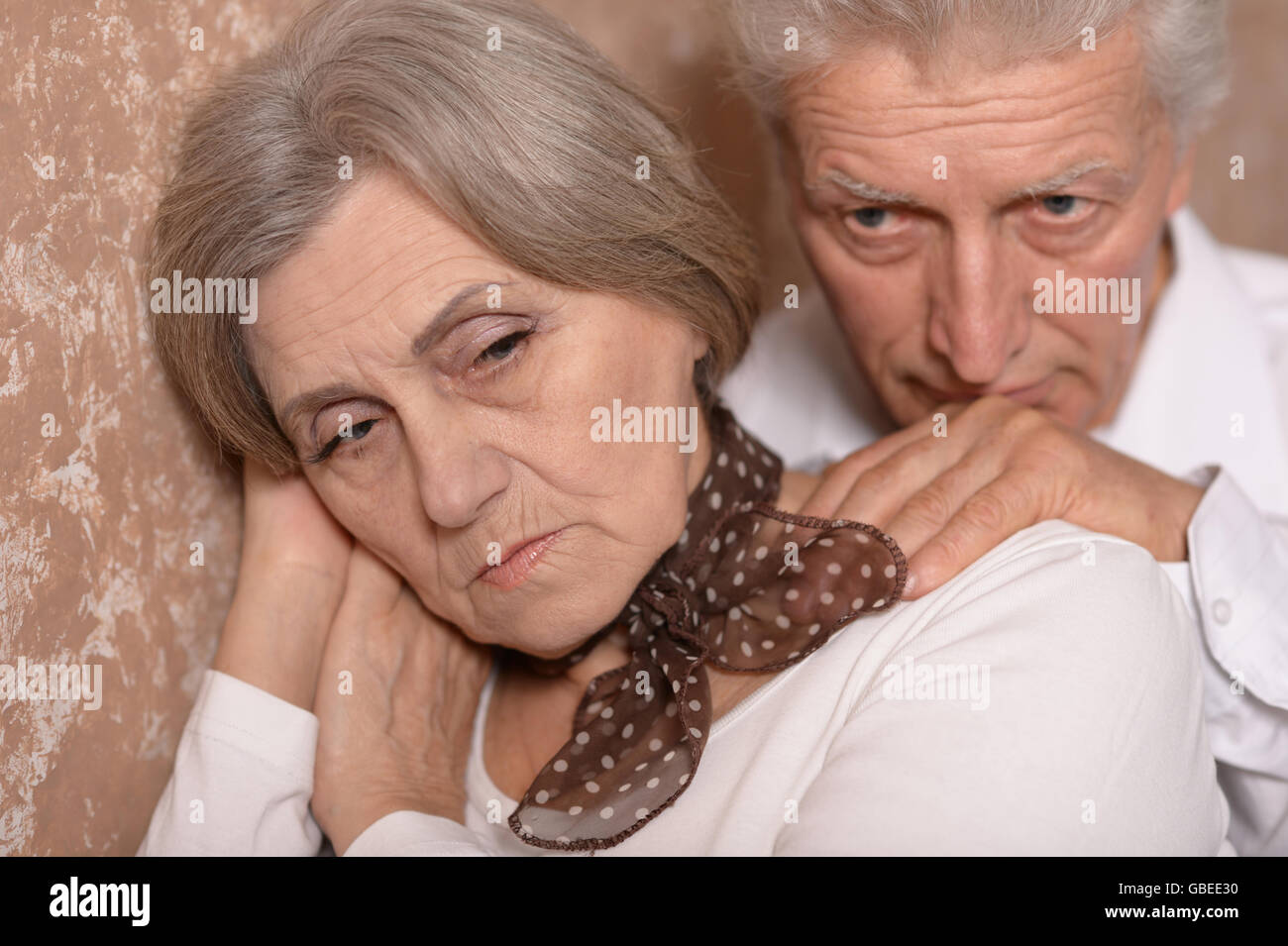 sad elder couple Stock Photo - Alamy