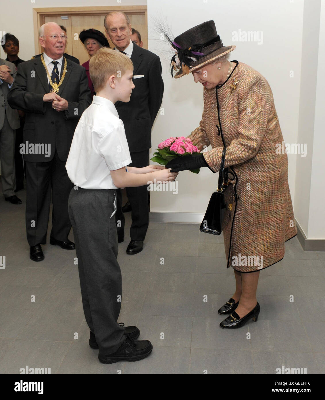 Queen Elizabeth II meets 9 year old George Taylor after she officially ...