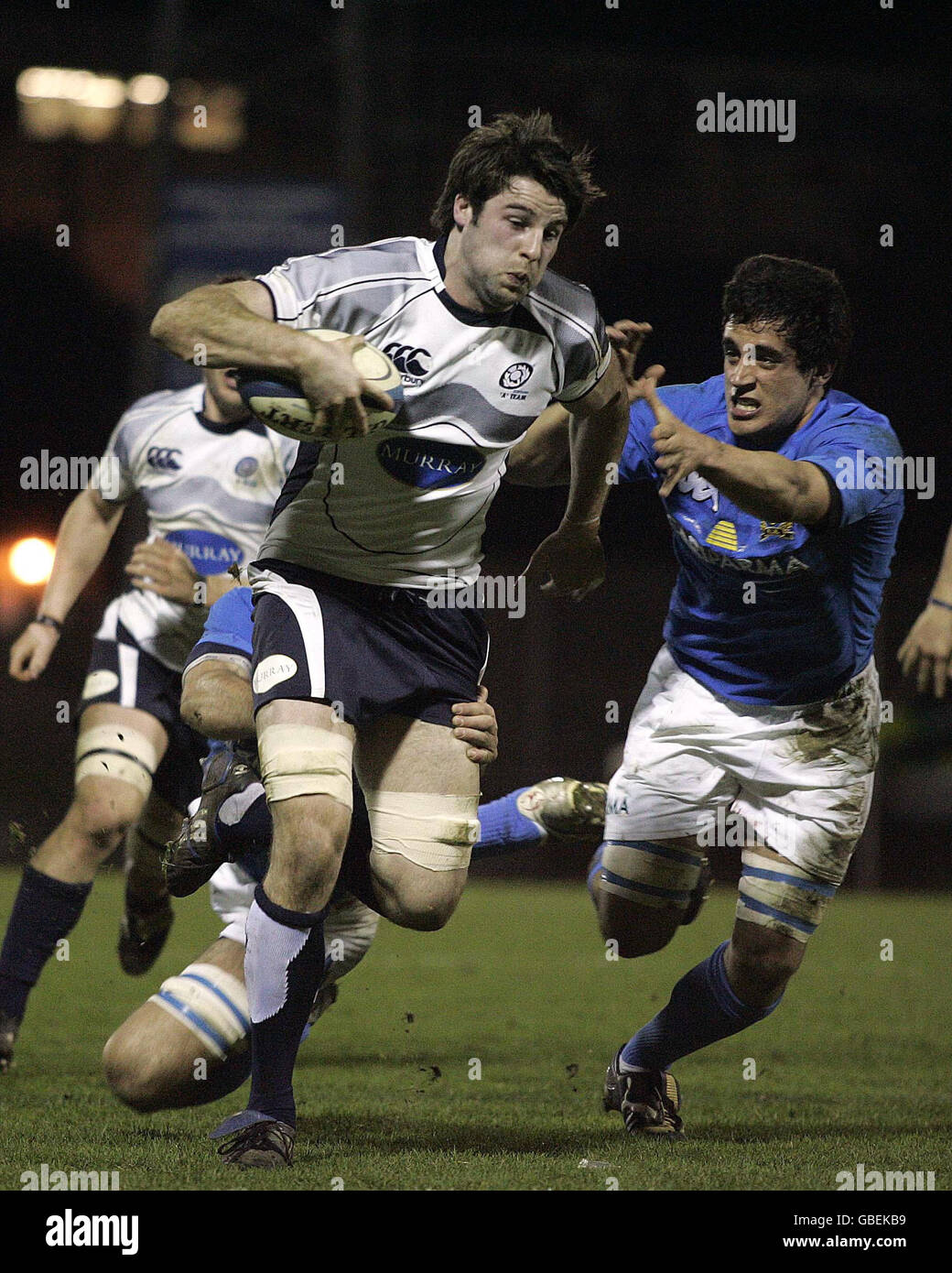Scotland A's Johnnie Beattie (centre) crashes through the Italy A ...