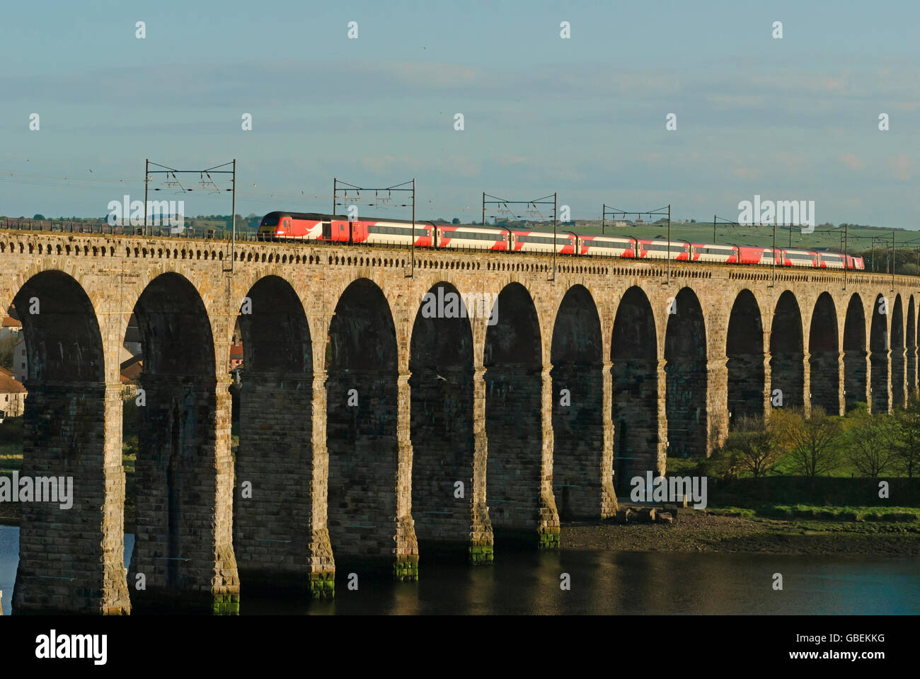 Intercity passenger train travelling over the railway viaduct built by ...