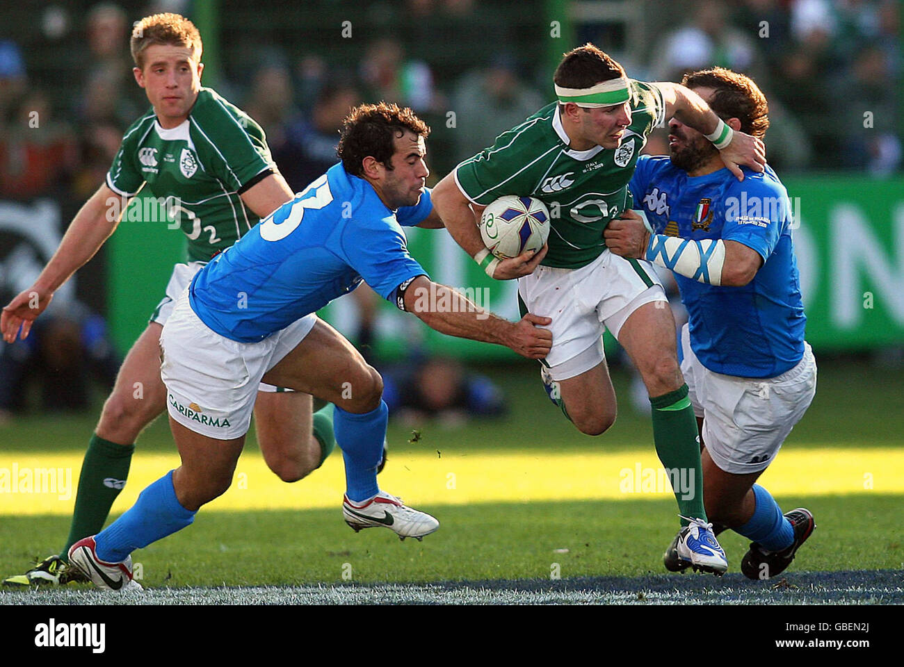 Ireland's Paddy Wallace and Luke Fitzgerald battle with Italy's Gonzalo ...
