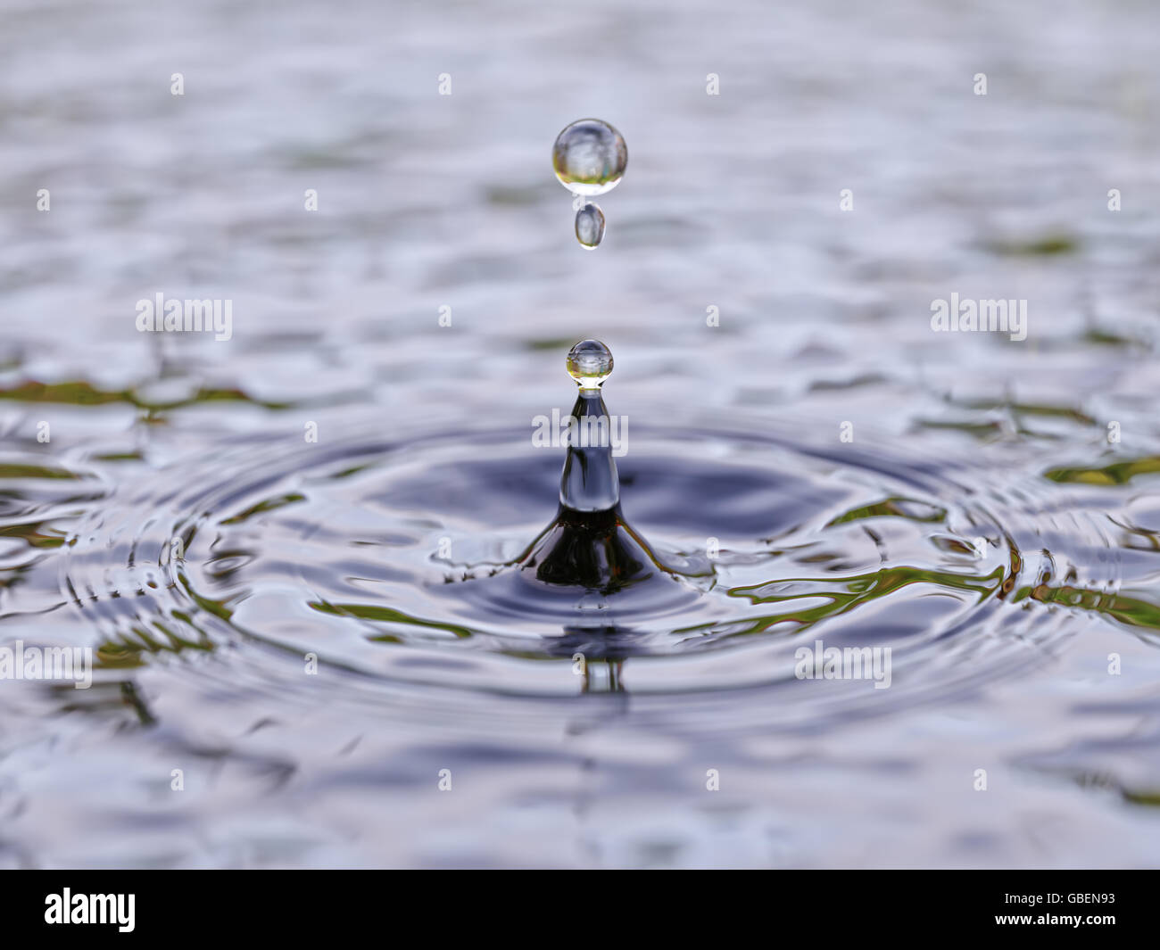 Rain drop splash in water closeup 3d illustration concept Stock Photo ...