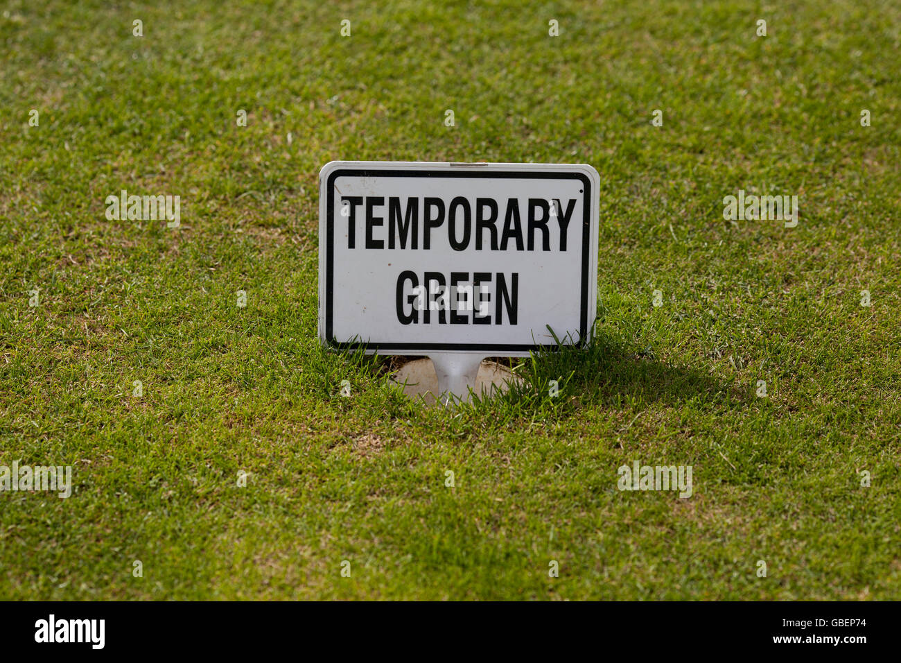 Temporary green sign on a golf course green Stock Photo - Alamy