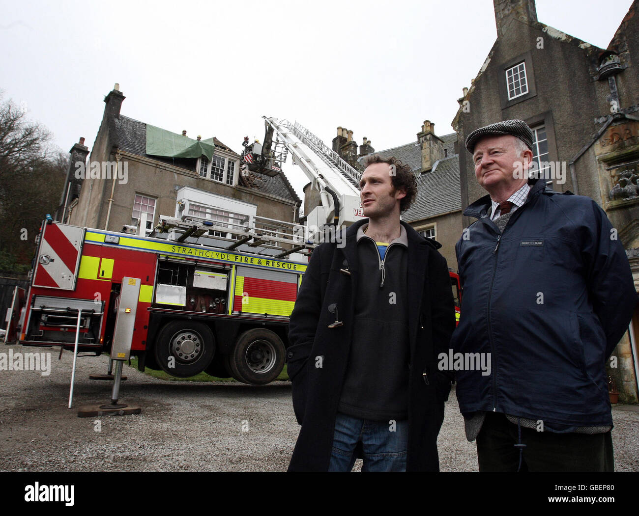 Lord Glasgow and his son David view the damage to Kelburn Castle after ...