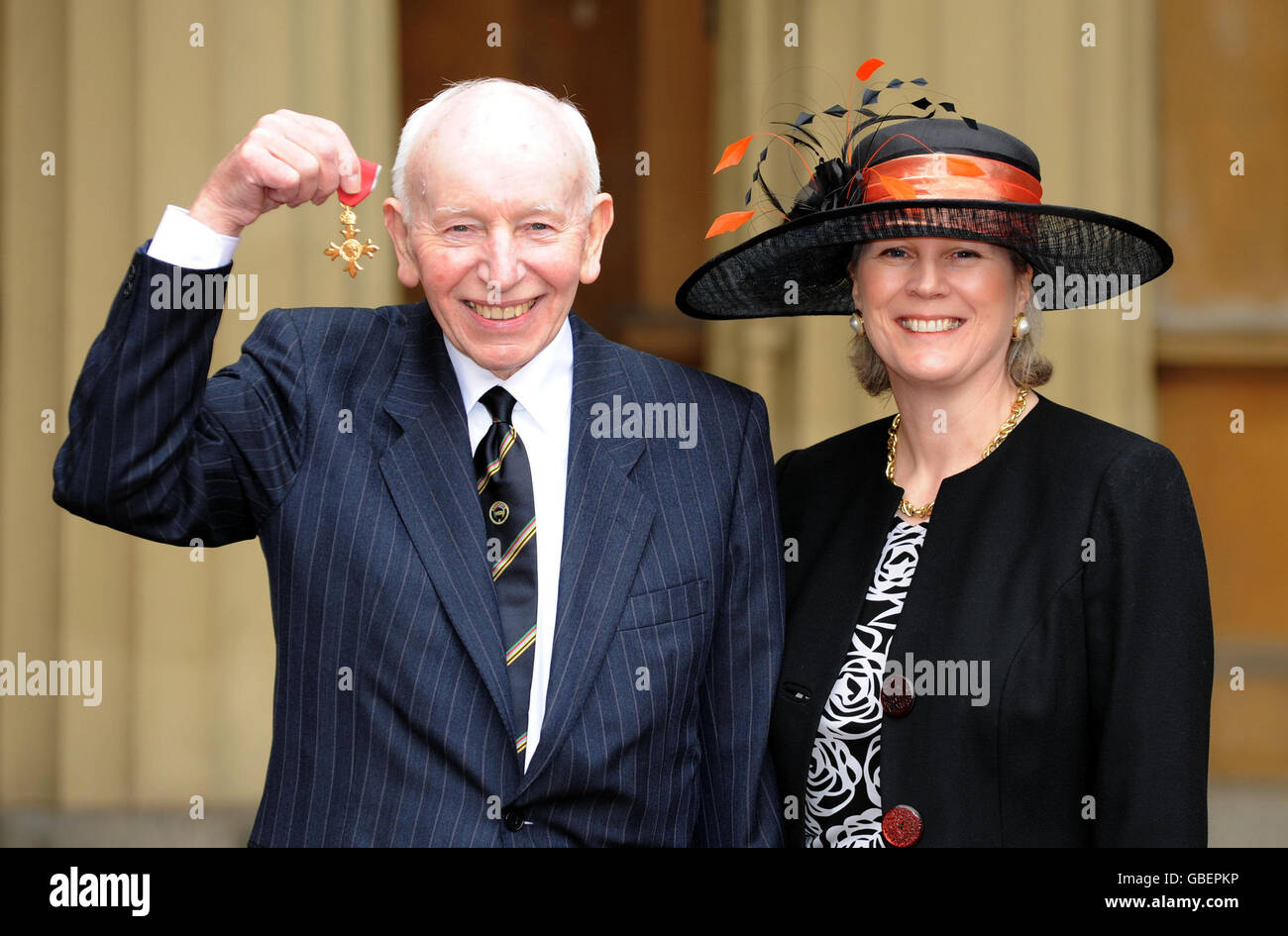 John surtees and his wife jane after he was awarded an obe by britain's ...