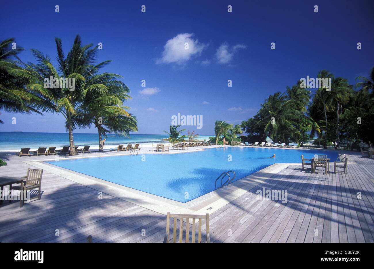 a pool at the seascape of the island and atoll of the Maldives Islands ...