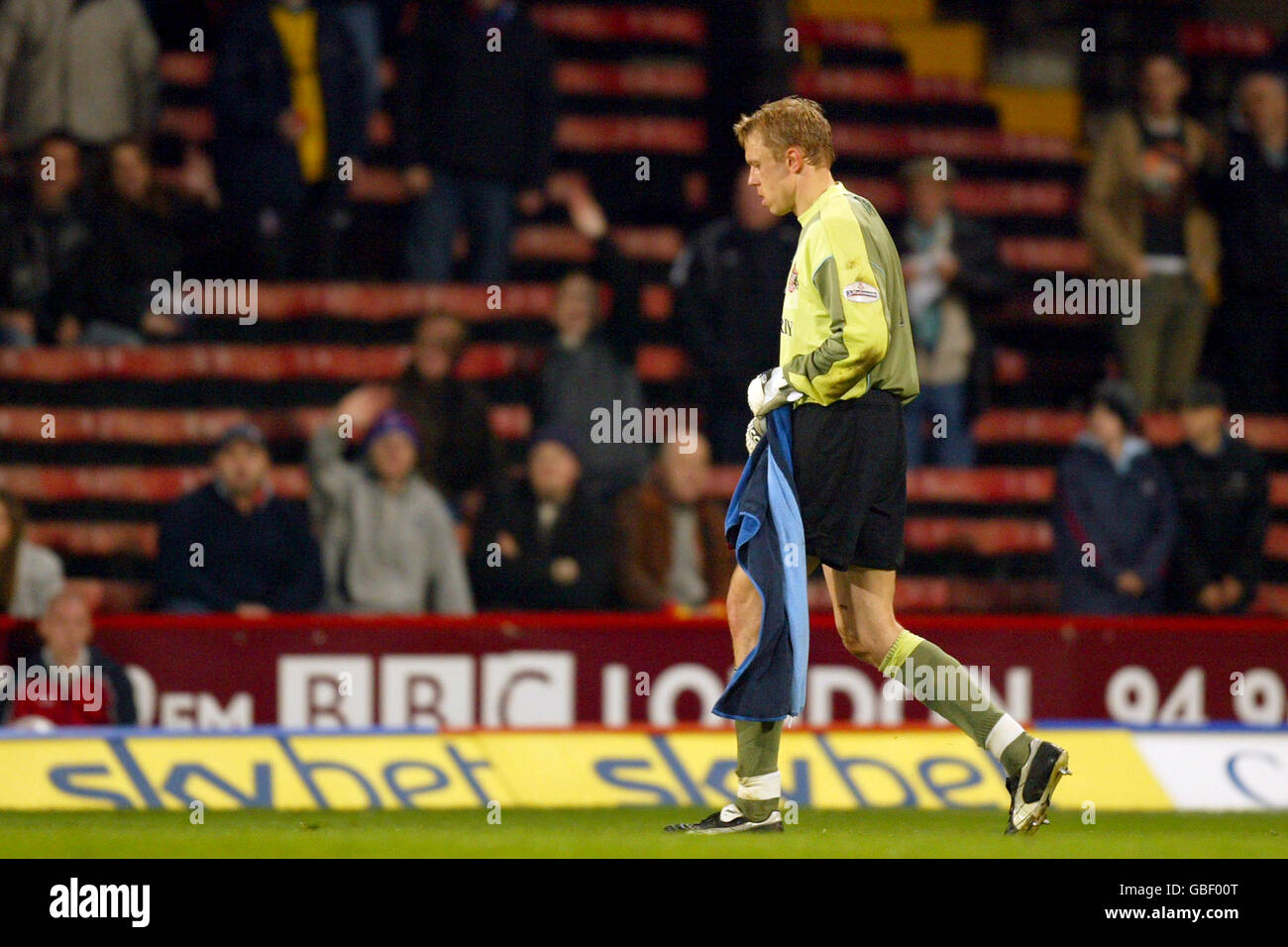 Sunderland's goalkeeper Mart Poom walks off dejected after being shown ...
