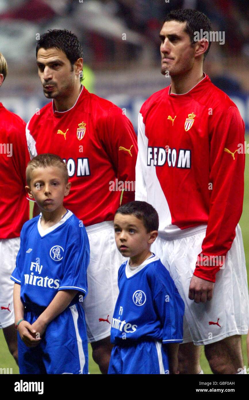 Monaco's Akis Zikos and Julien Rodriguez (r) line up with mascots prior ...