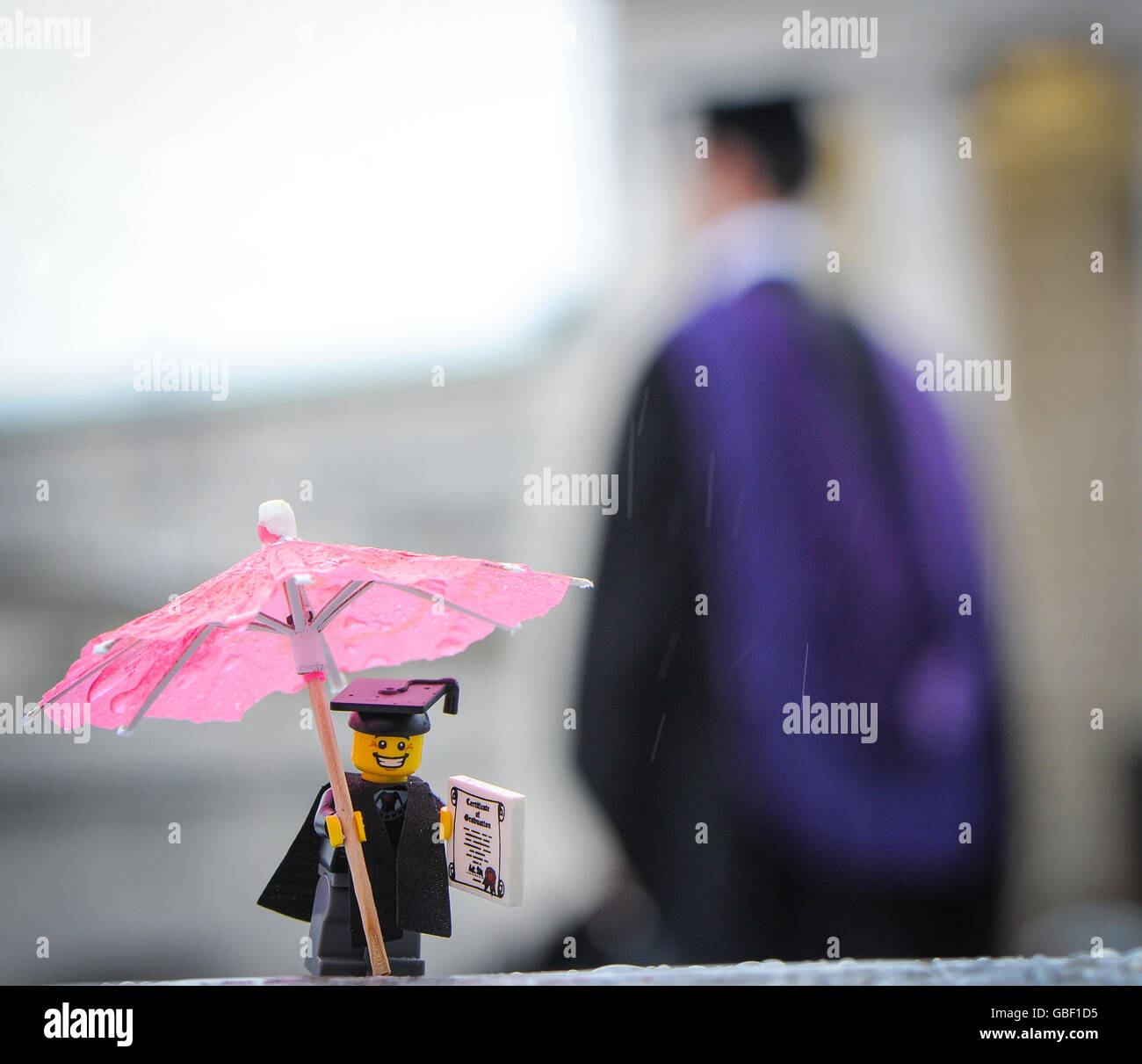 Graduation Lego man in rain Stock Photo - Alamy