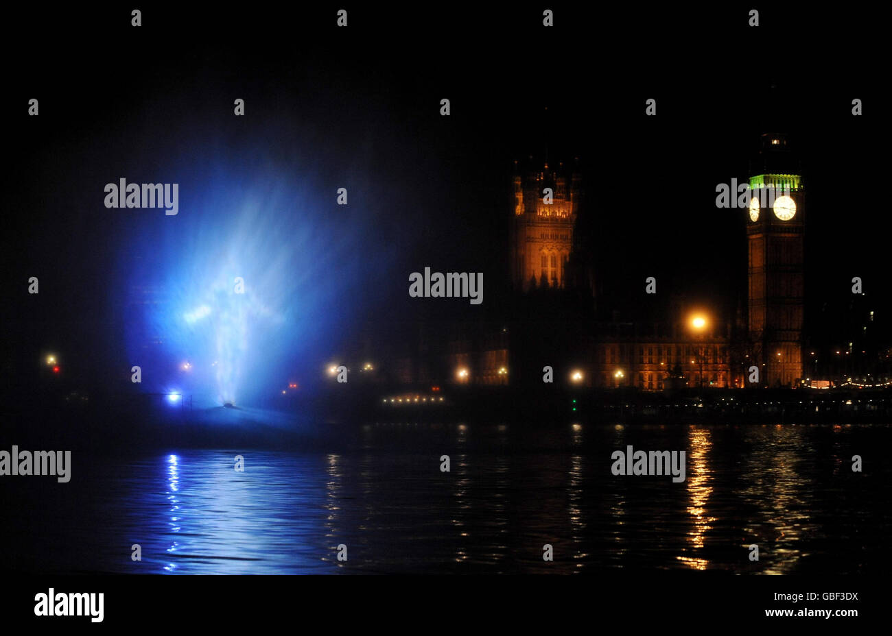 A giant water projection is seen over the Thames in central London to ...