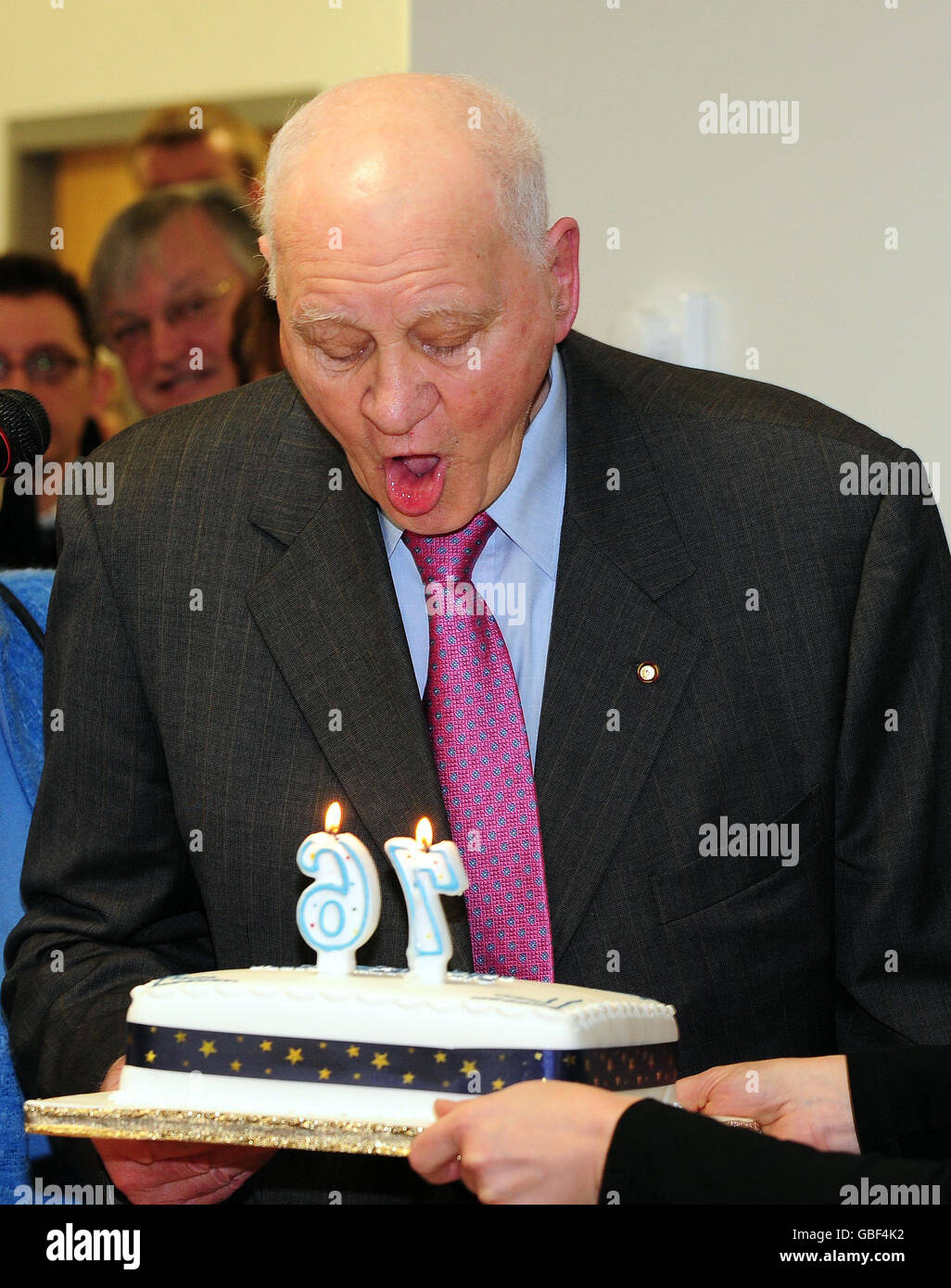 Sir Bobby Robson, who turned 76 on Wednesday, blows out the candles on ...