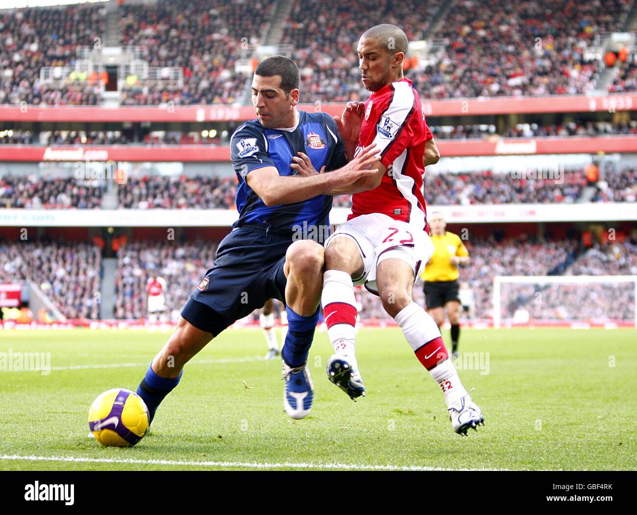 Sunderland's Tal Ben-Haim (left) and Arsenal's Gael Clichy battle for ...