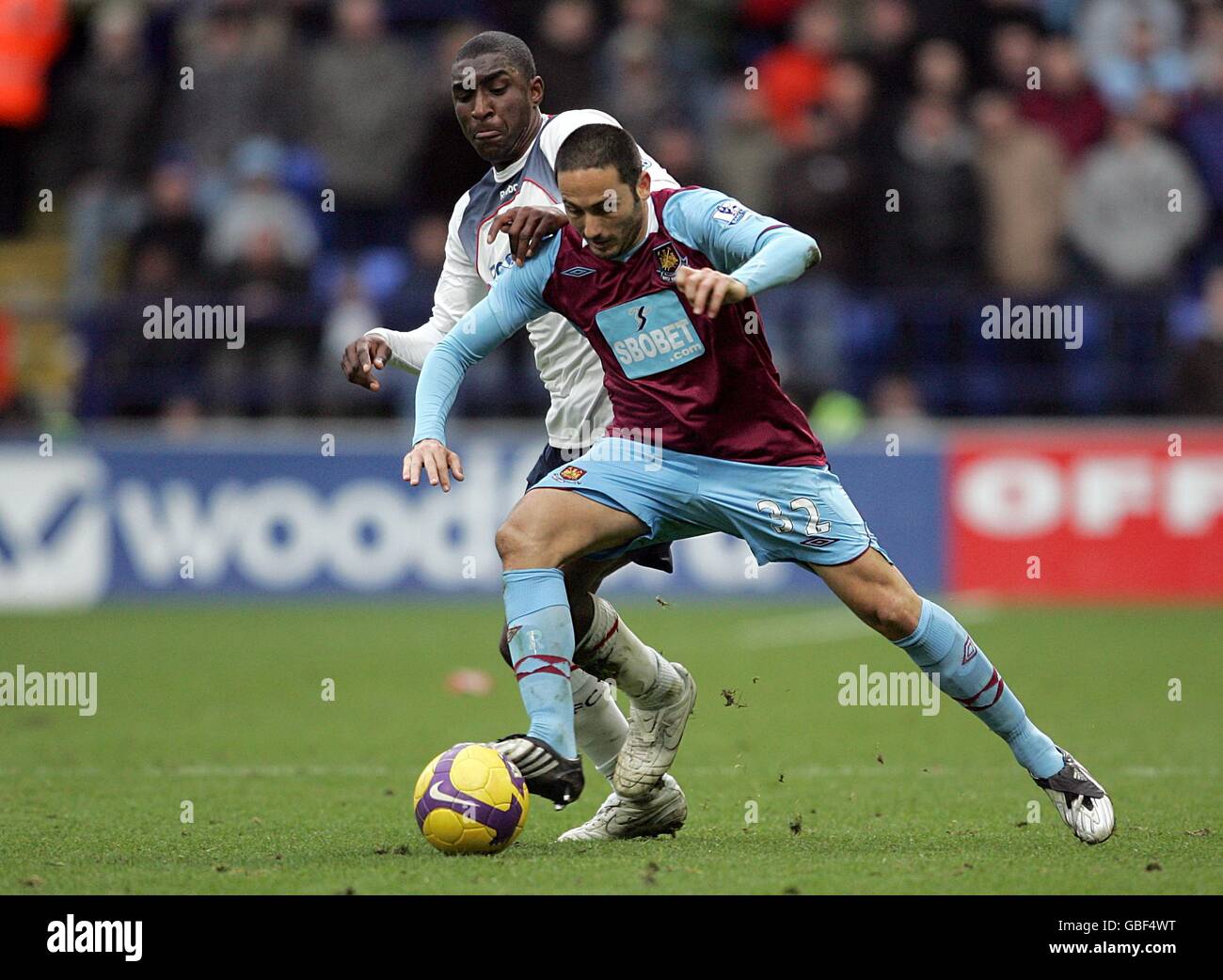 Bolton Wanderers' Jlloyd Samuel (left) and West Ham United's Daniel Di ...