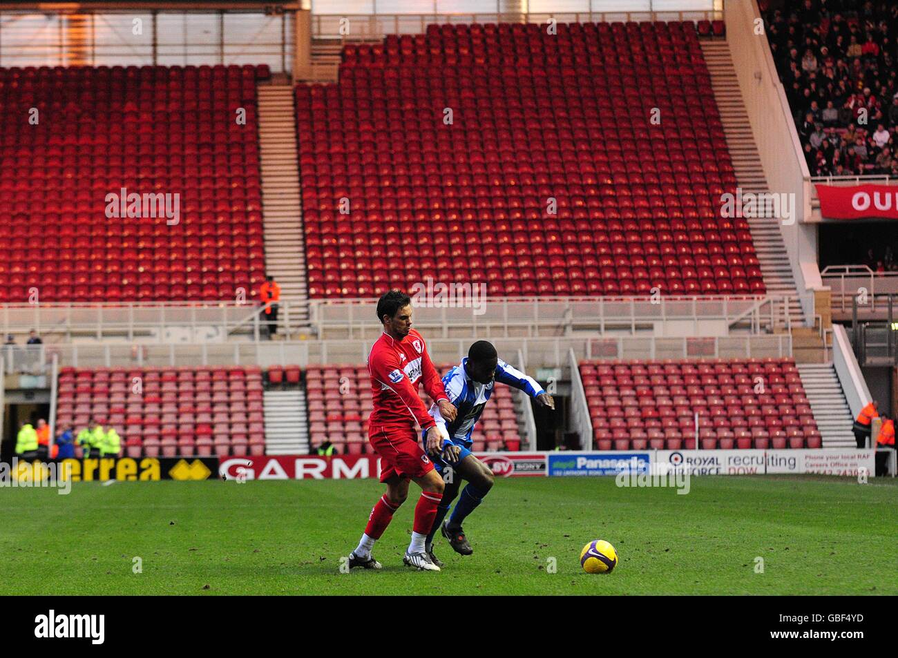 Ball football action empty seats datacoapplies hi-res stock photography ...