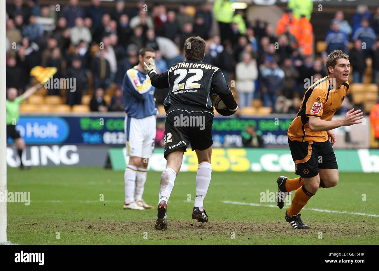 The linesman raises his flag while Wolverhampton Wanderers' Sam Vokes ...