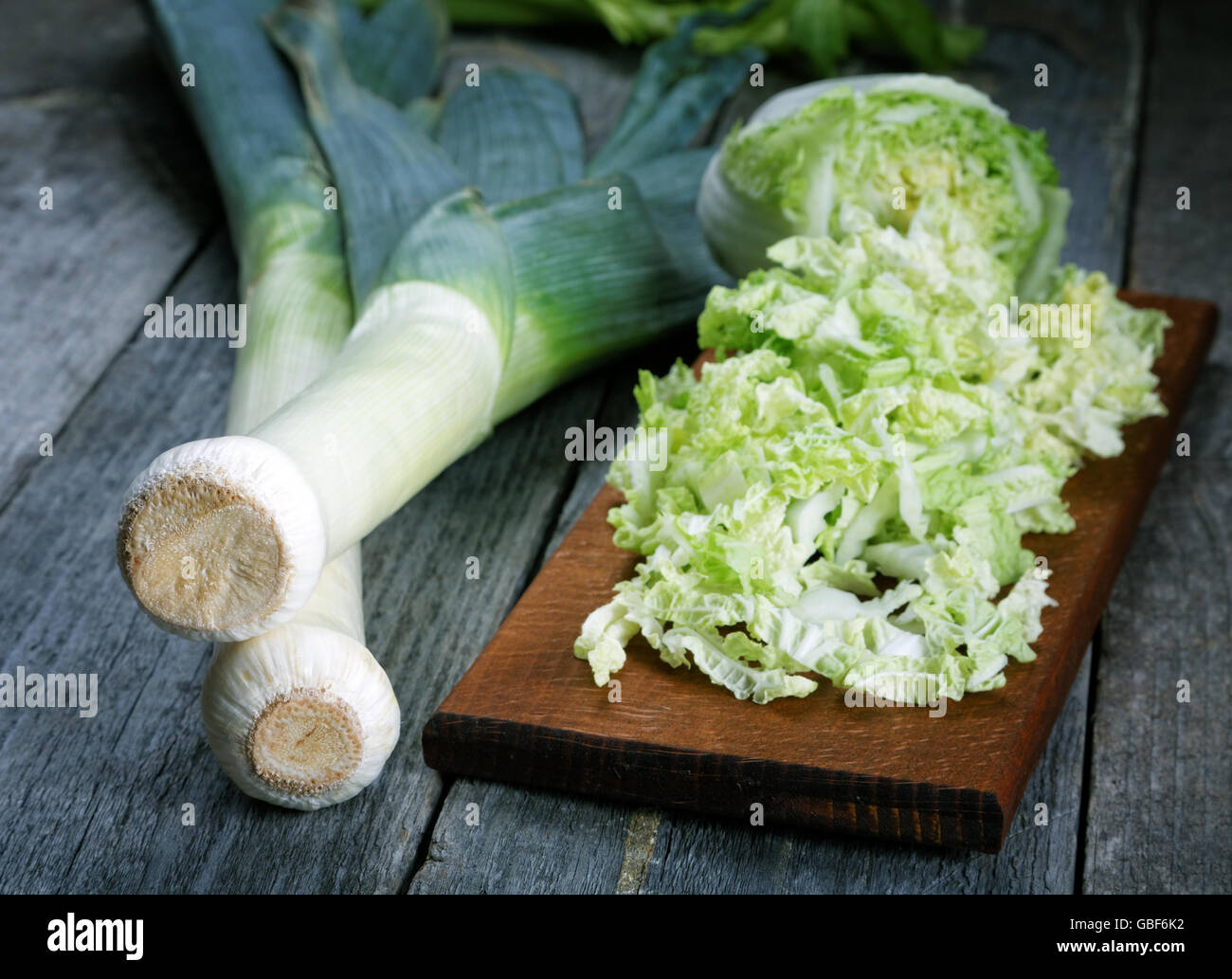 sliced cabbage and shallot on a rustic table Stock Photo - Alamy