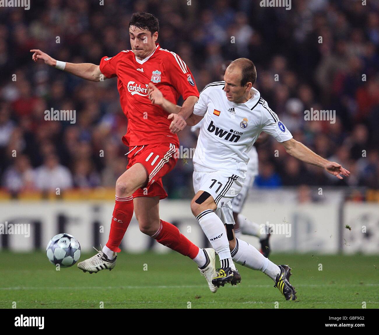 Liverpool's Albert Riera (left) and Real Madrid's Arjen Robben battle ...