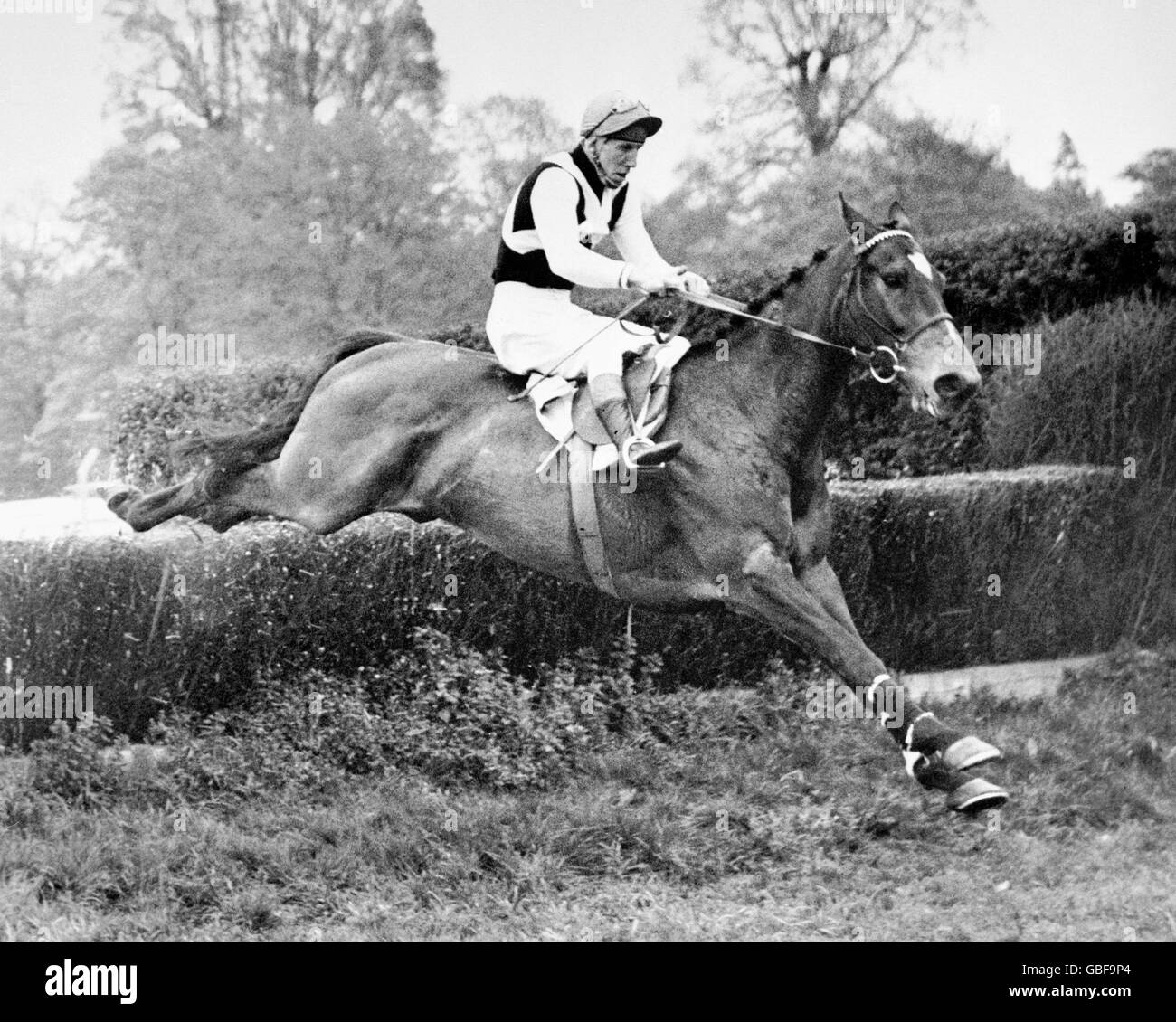 Mill House, David Nicholson up, clears the last fence before going on ...