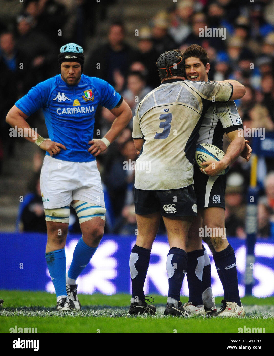 Scotland's Scott Gray is congratulated by Euan Murray after scoring ...