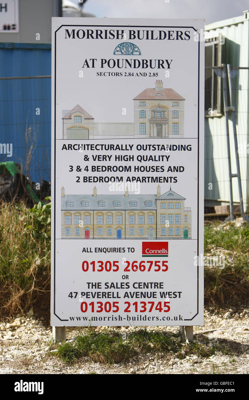 General view of a sign for Morrish Builders as building work goes on in ...