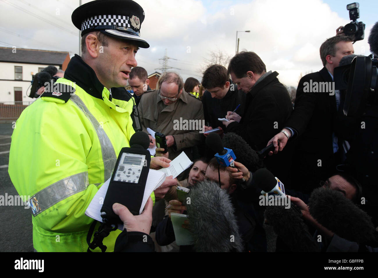 Man takes over factory with explosive device Stock Photo - Alamy
