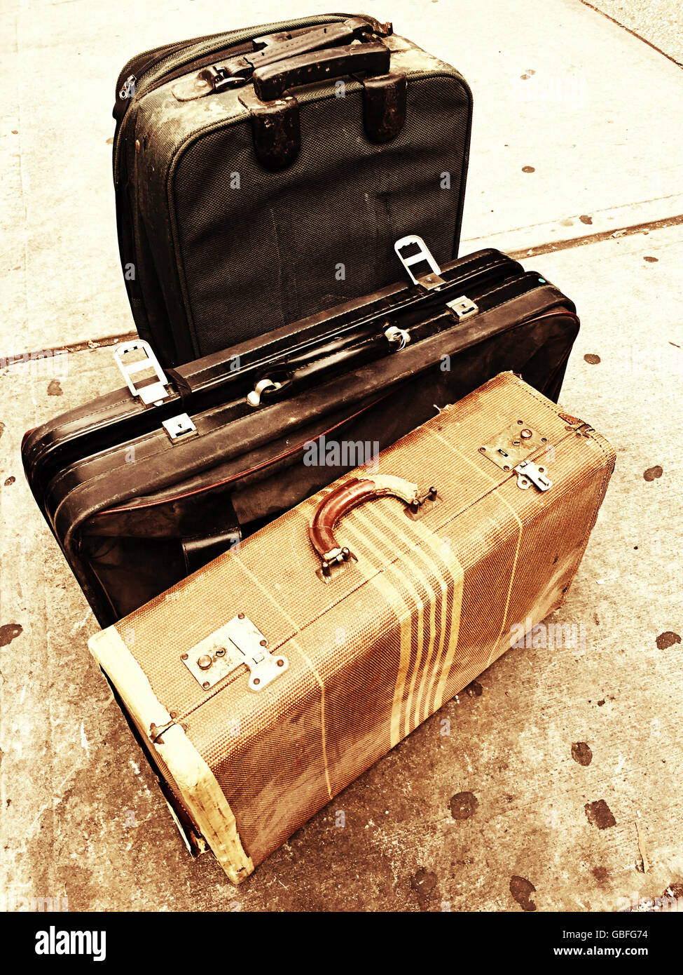 Abandoned Suitcases on City Sidewalk Stock Photo - Alamy